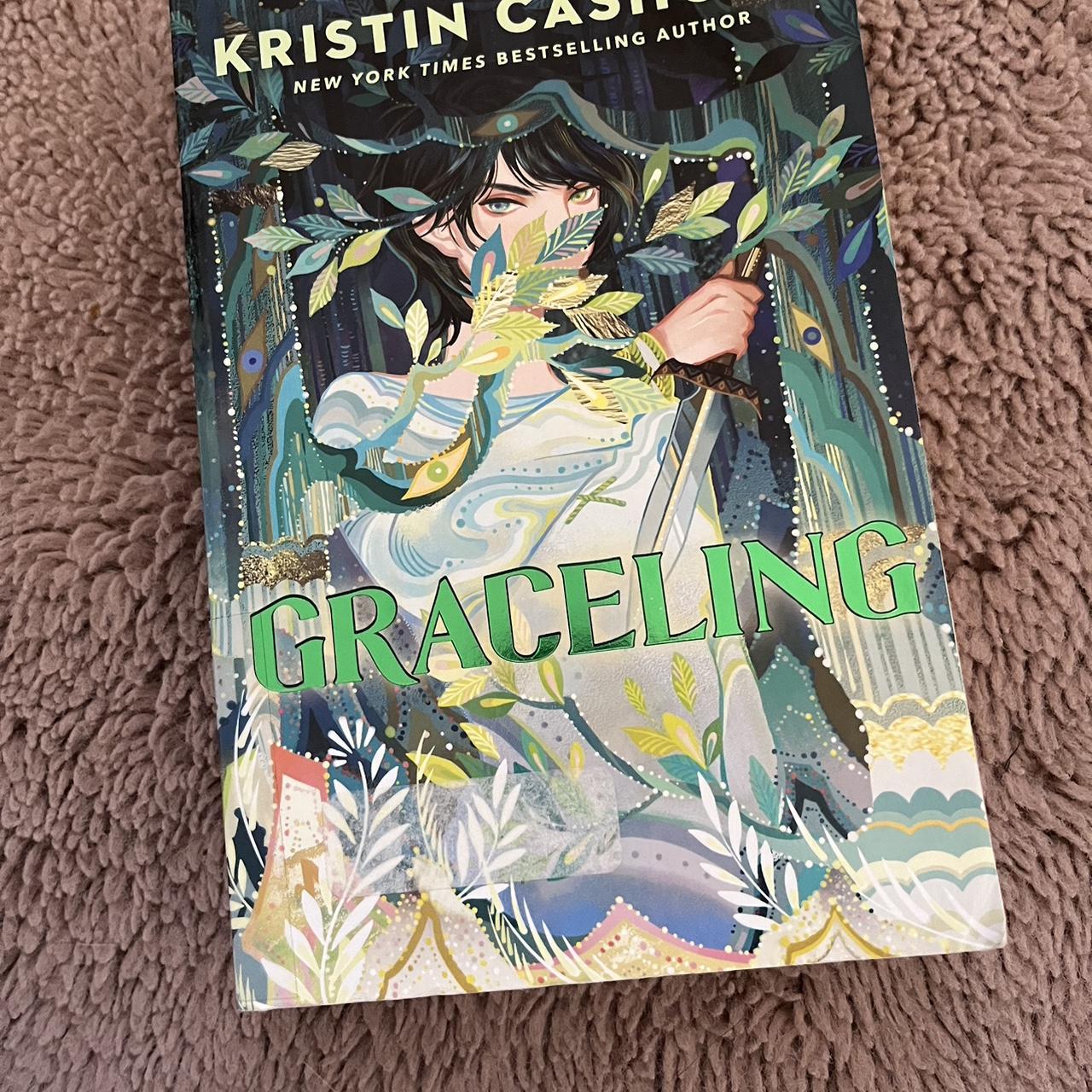 Graceling book by Kristin Cashore - Depop