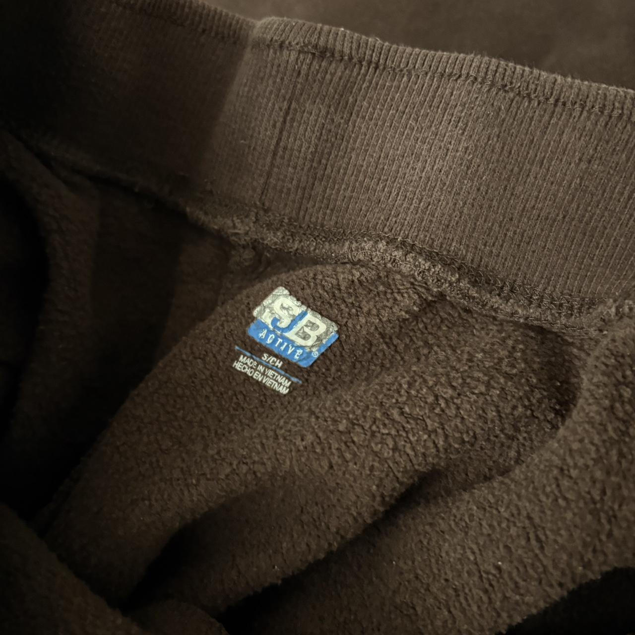 Y2k like brown low rise sweatpants with pink strips... | Depop