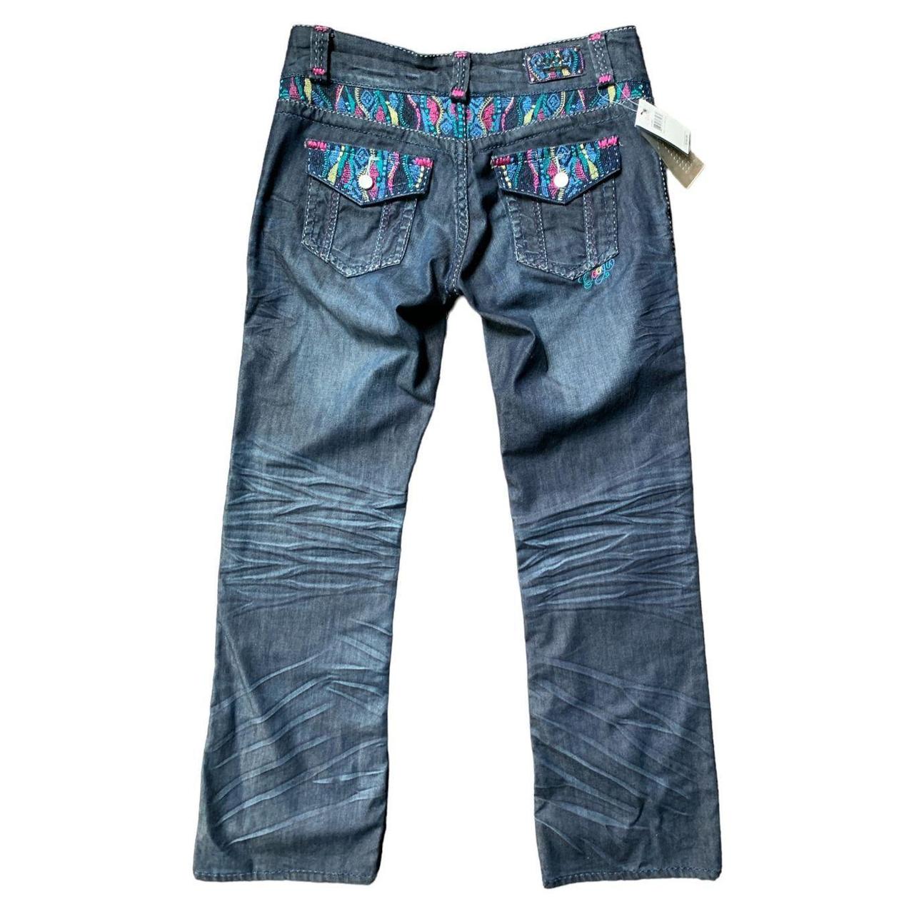 COOGI. Dark blue jeans with colorful embroidery.... - Depop