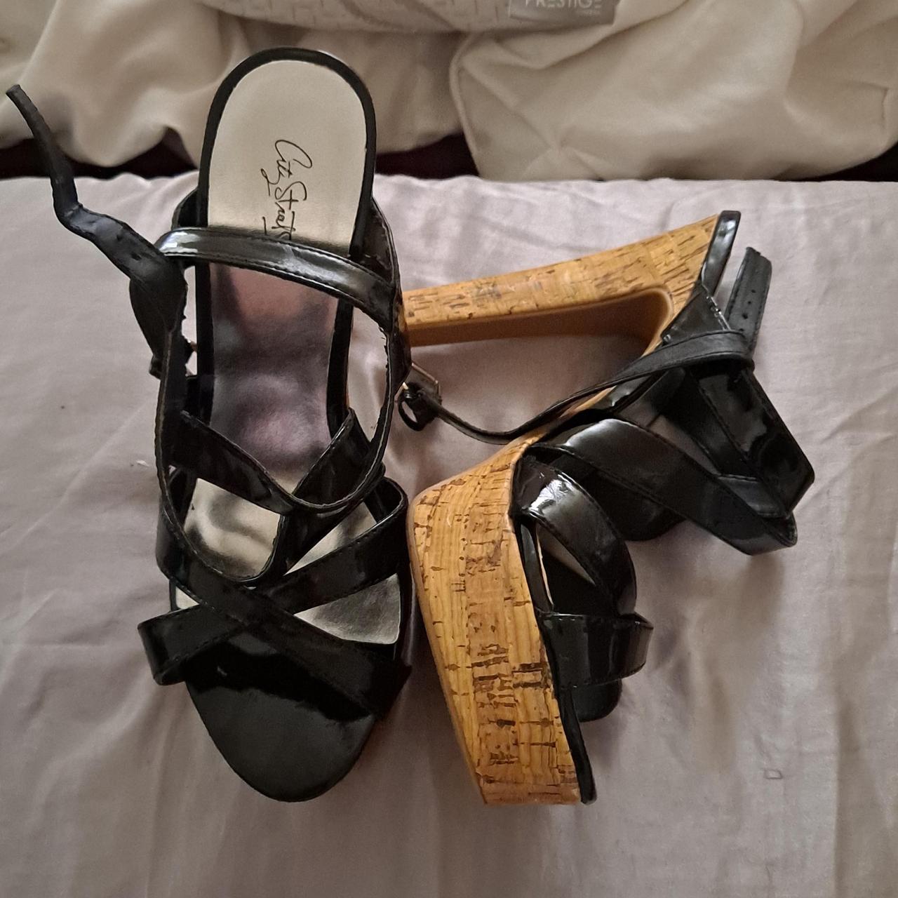 These are a pair of wedged open toed highheel... - Depop