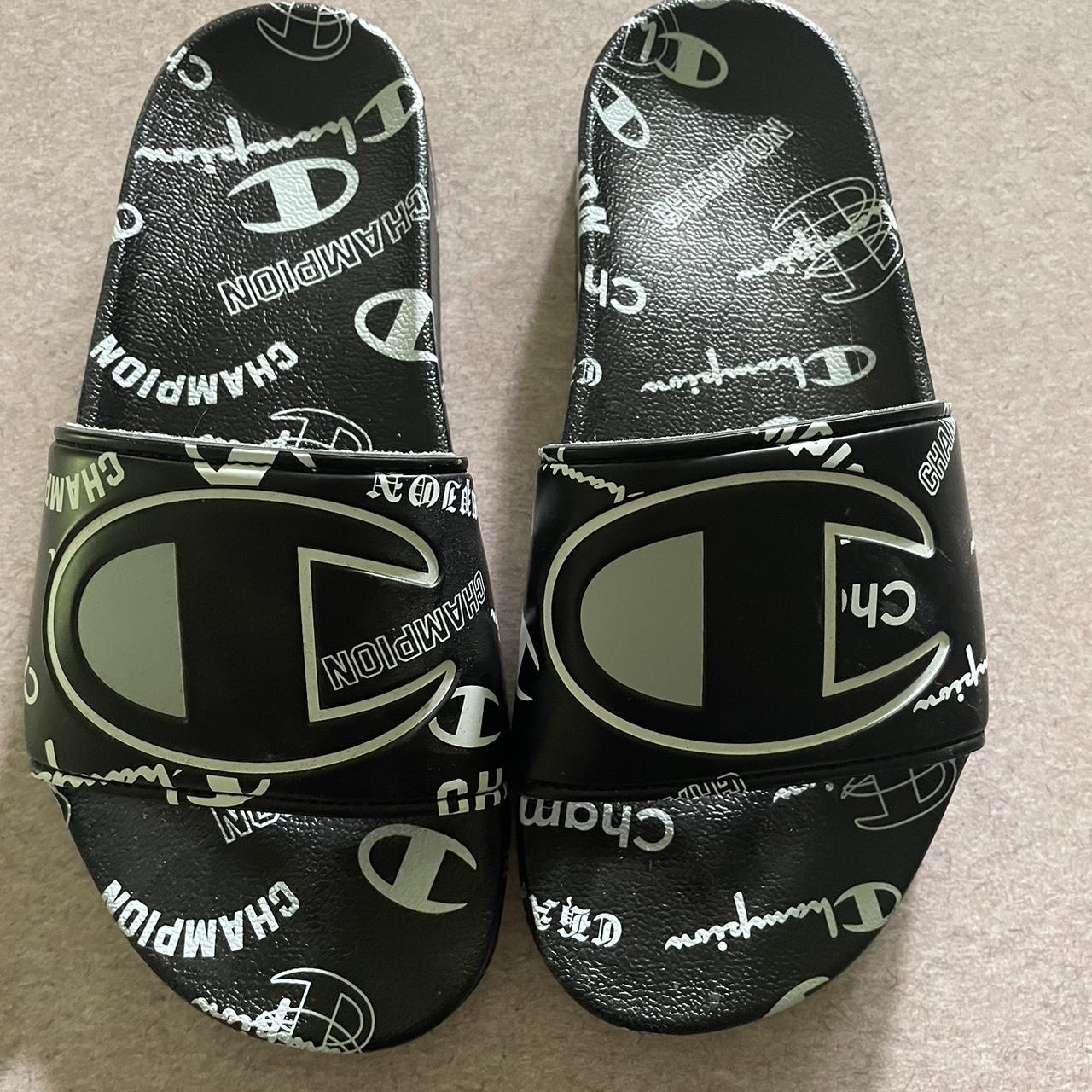 Size 7 in women’s black and white champion slides - Depop