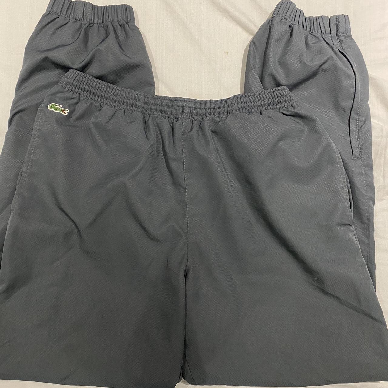 grey Lacoste tracksuit bottoms hard to get mint... - Depop