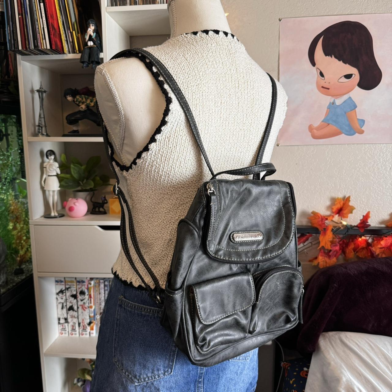 Black leather backpack with pockets and adjustable... - Depop