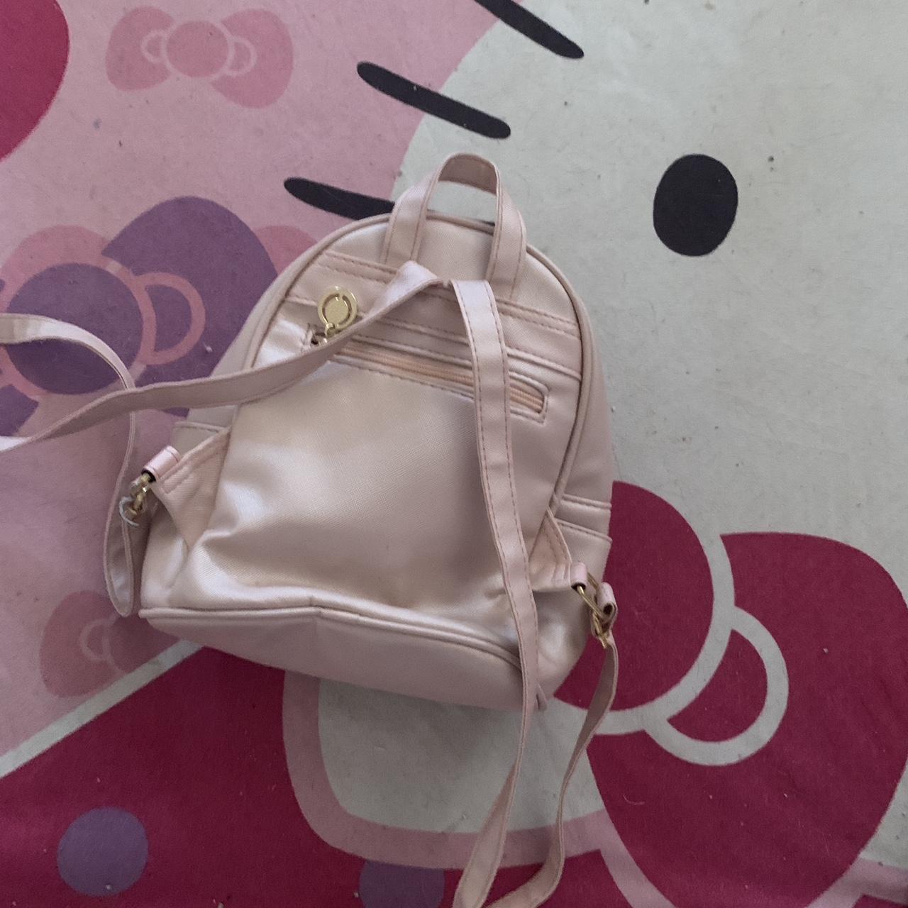 pink mini backpack. Reminds me of k-12 vibes!... - Depop