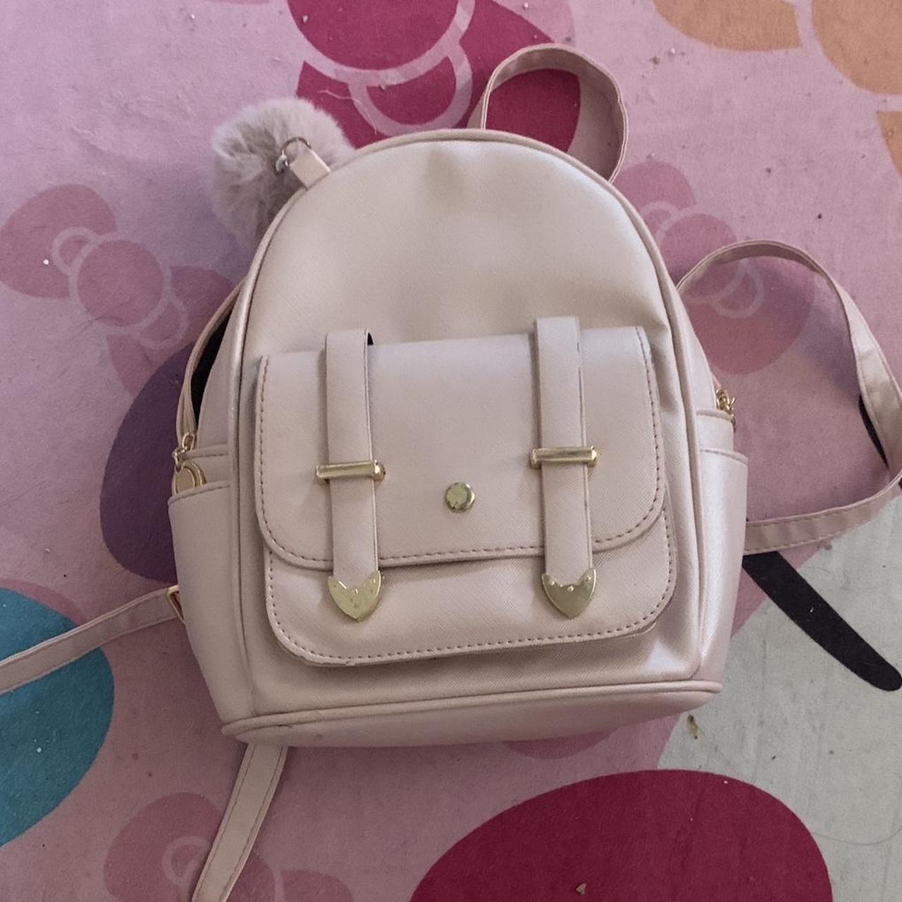 pink mini backpack. Reminds me of k-12 vibes!... - Depop