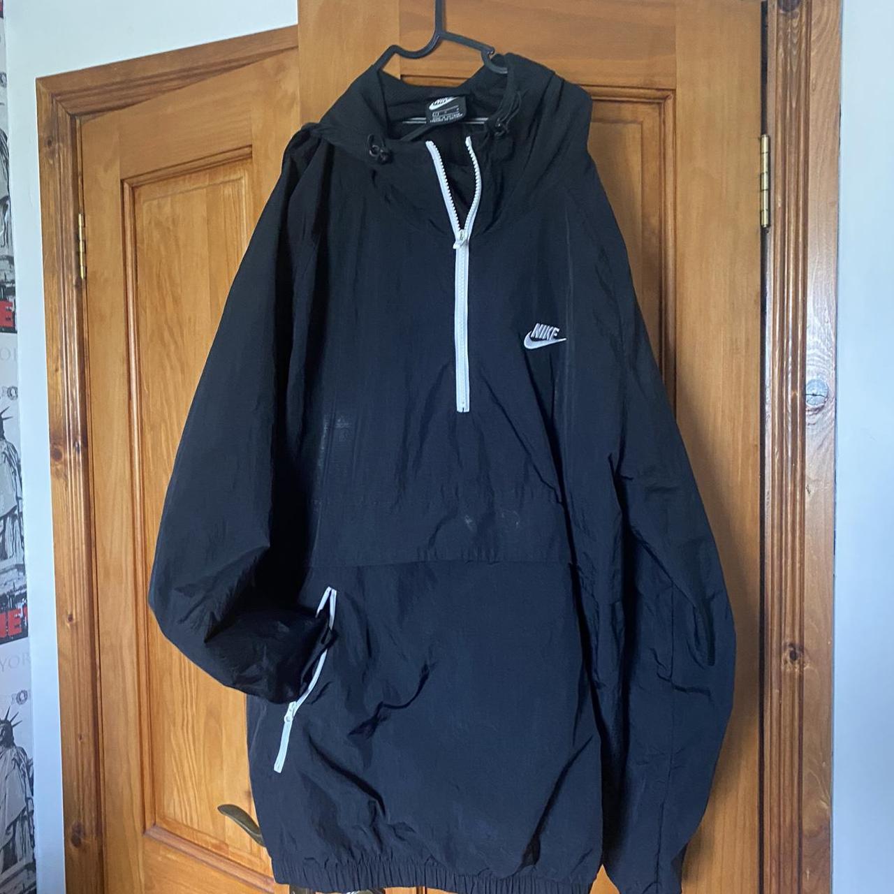 Nike black half- zip windbreaker, Jacket has pouch... - Depop