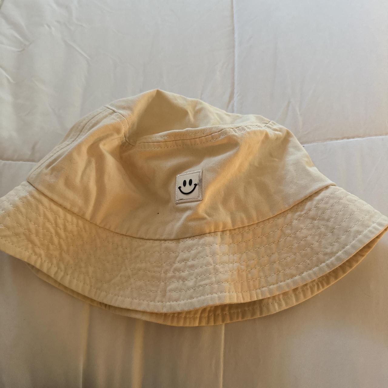 Smiley face tan bucket hat - Depop