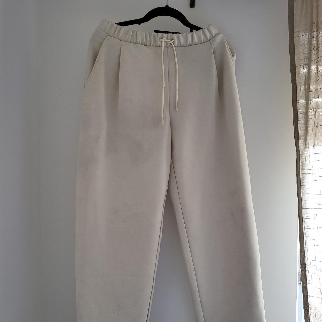 Uniqlo tracksuit bottoms with watermarks, size... - Depop