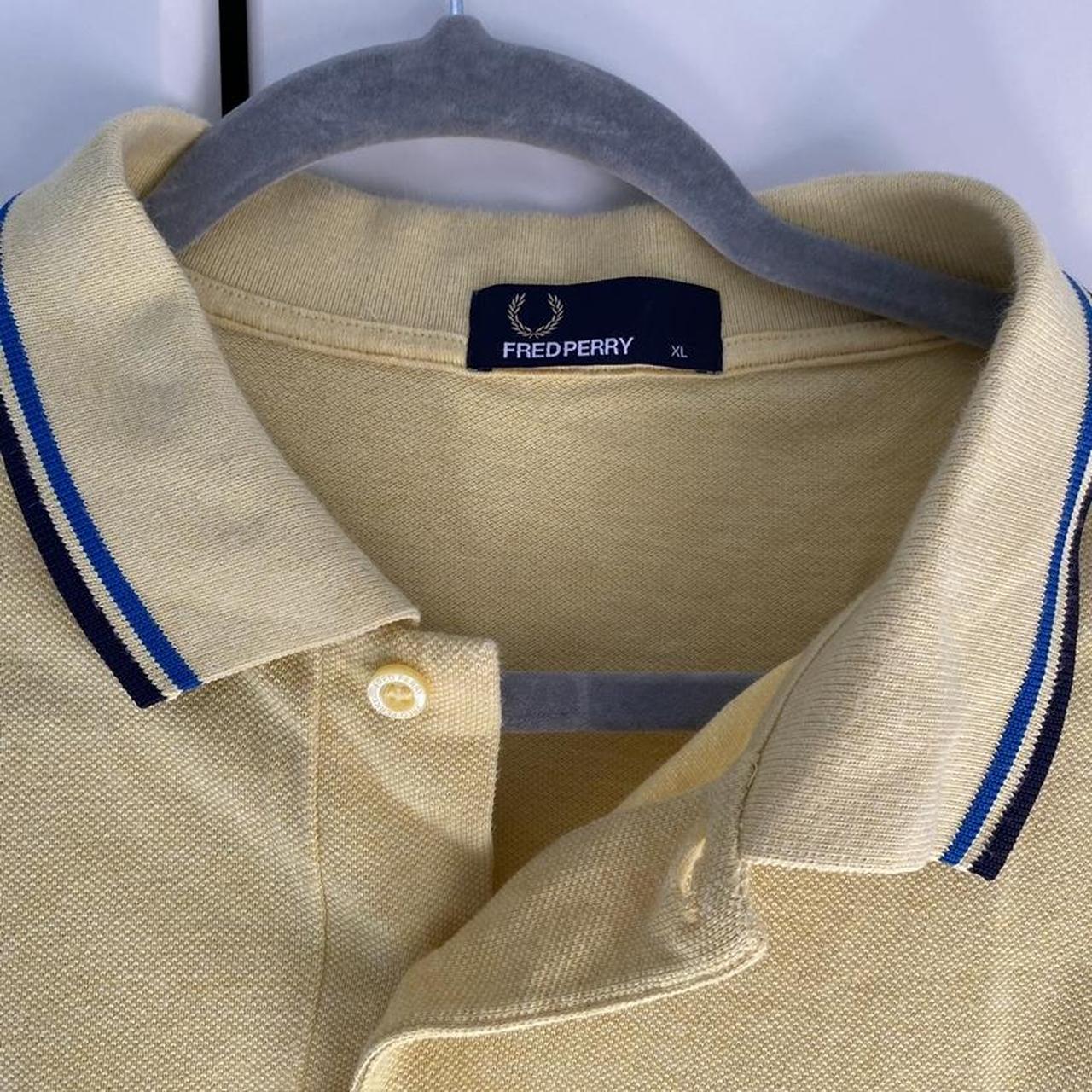 Yellow Fred Perry shirt with black and blue accents - Depop