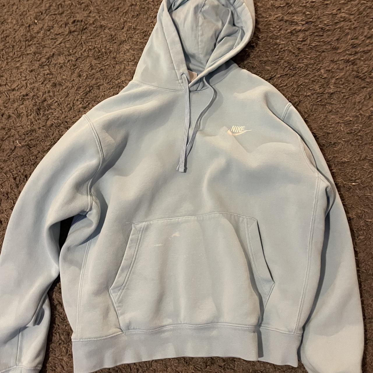 Size M light blue Nike hoodie. Slight white stains,... - Depop