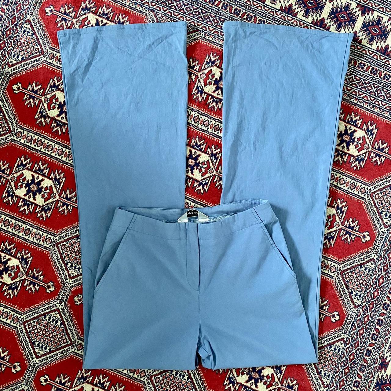 Dreamy powder blue mid waist flared trousers from... - Depop