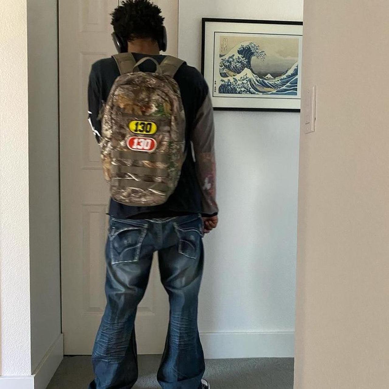 130 World backpack minor rip dm before buying - Depop