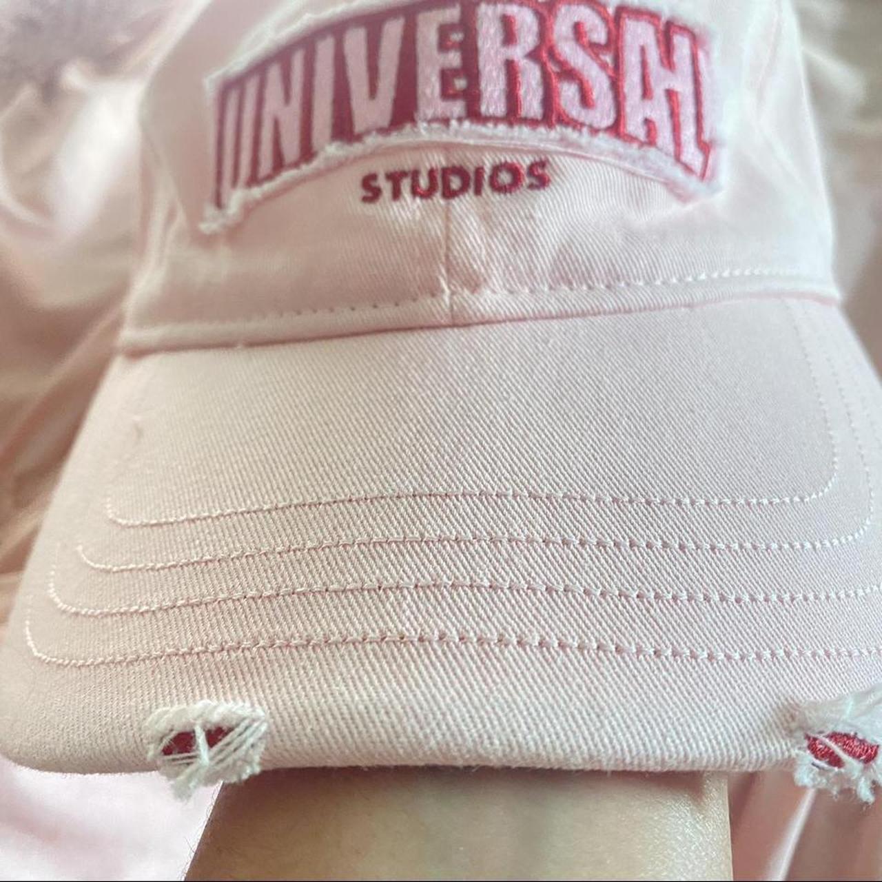 Trashy y2k pink universal studios pink hat. rips are... - Depop