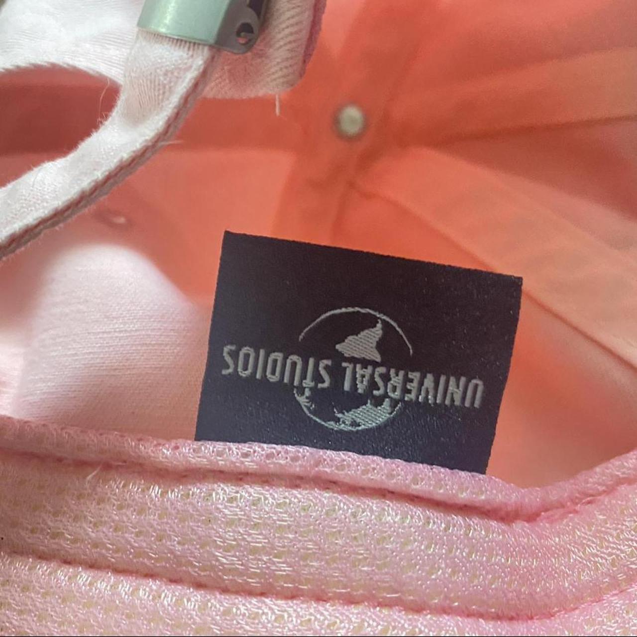 Trashy y2k pink universal studios pink hat. rips are... - Depop