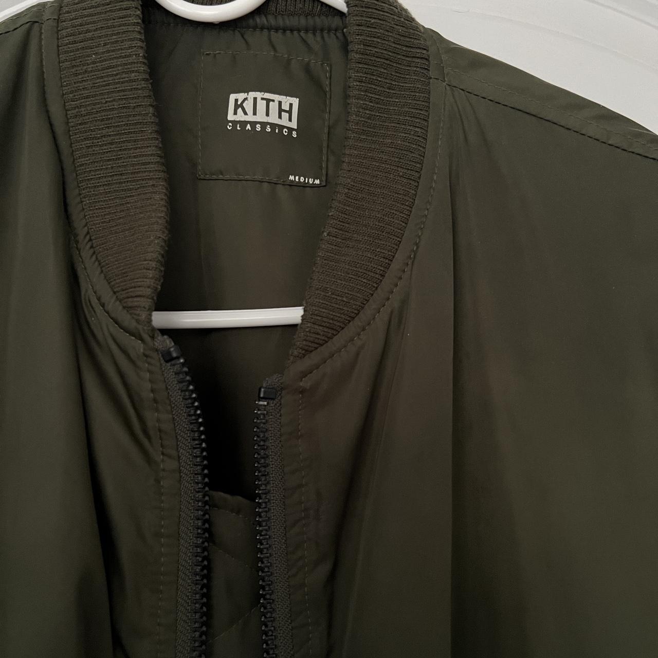 Kith olive bomber (medium) Worn a lot, has stains on... - Depop