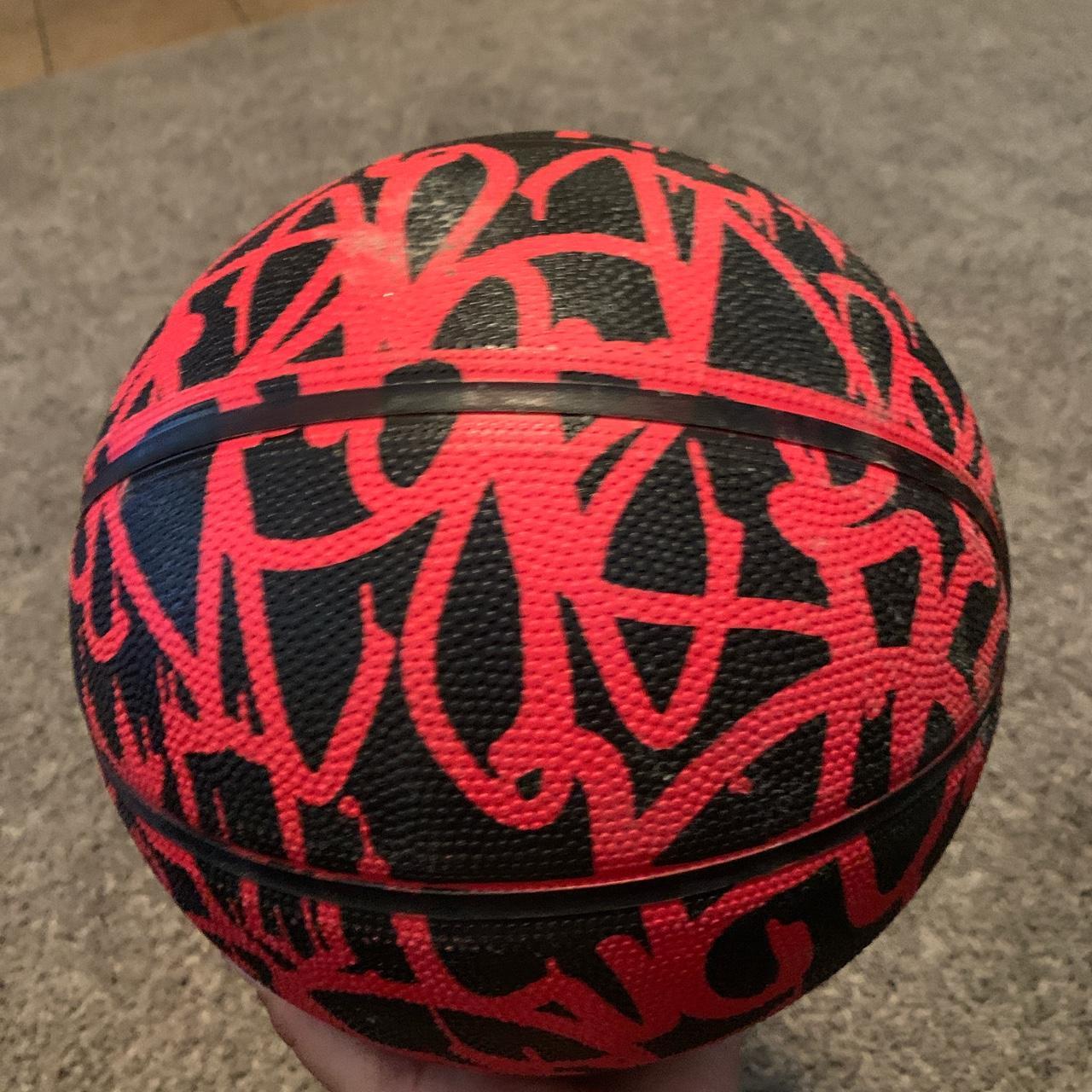 A red and black basketball - Depop