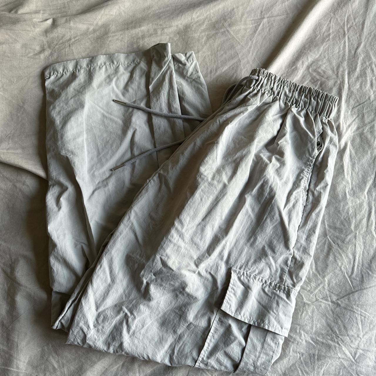 Medium size drawstring nylon cargo pants in grey... - Depop
