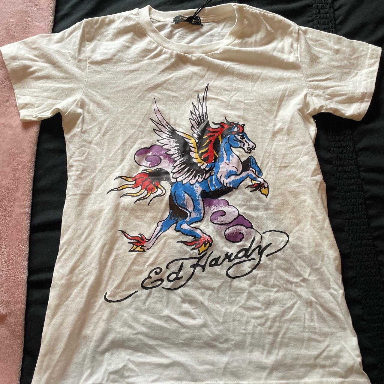 white unicorn ed hardy girls t-shirt size: 15-16... - Depop