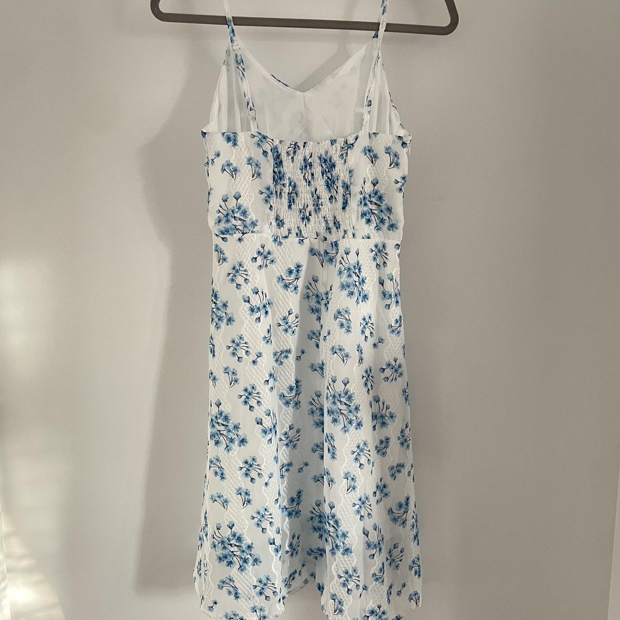 White with blue flowers pattern, below knee-length... - Depop