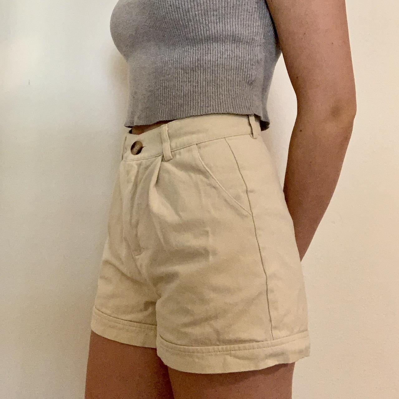Medium sized creamed color shorts. High rise & nice... - Depop