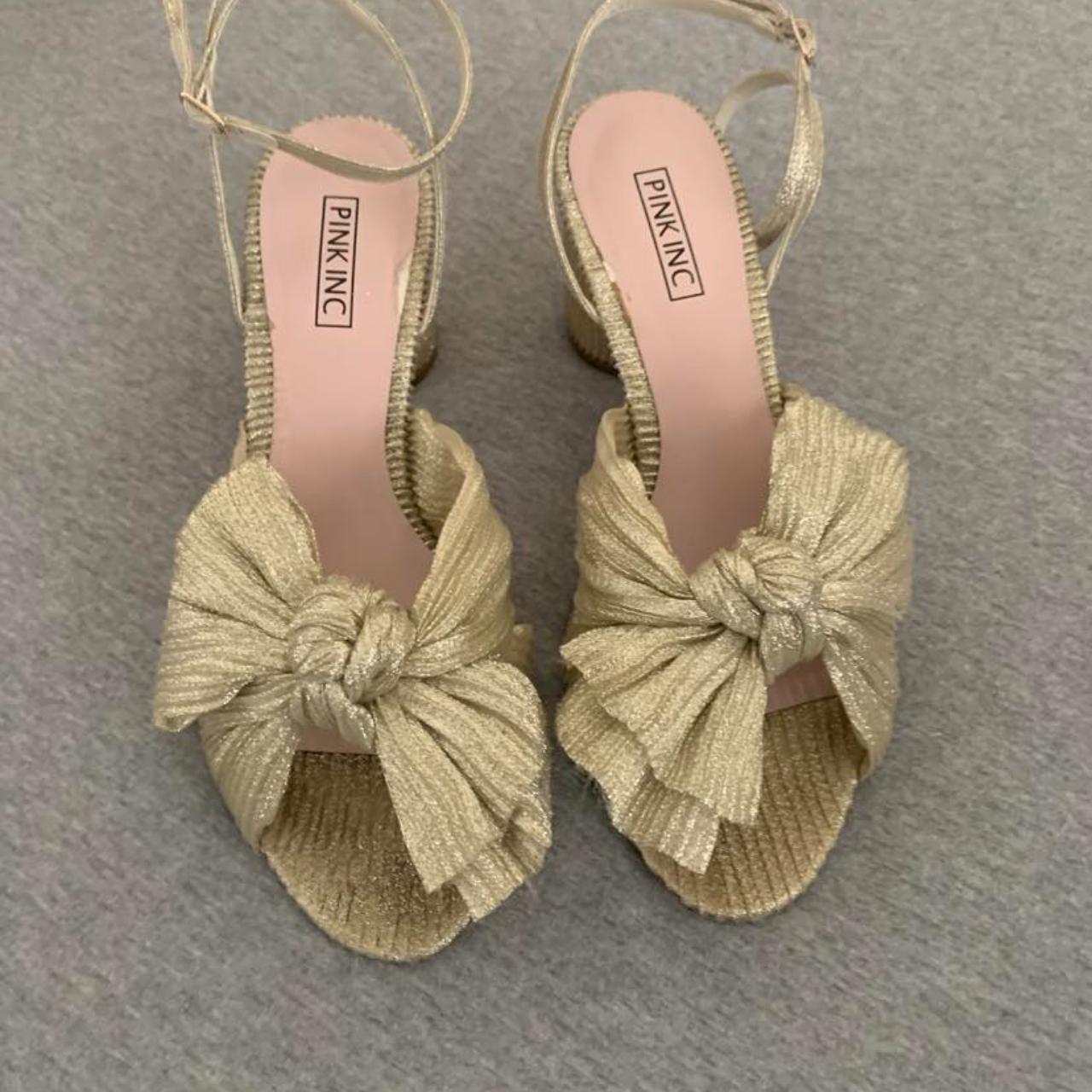 Beautiful statement heels in gold with cute bow.... - Depop