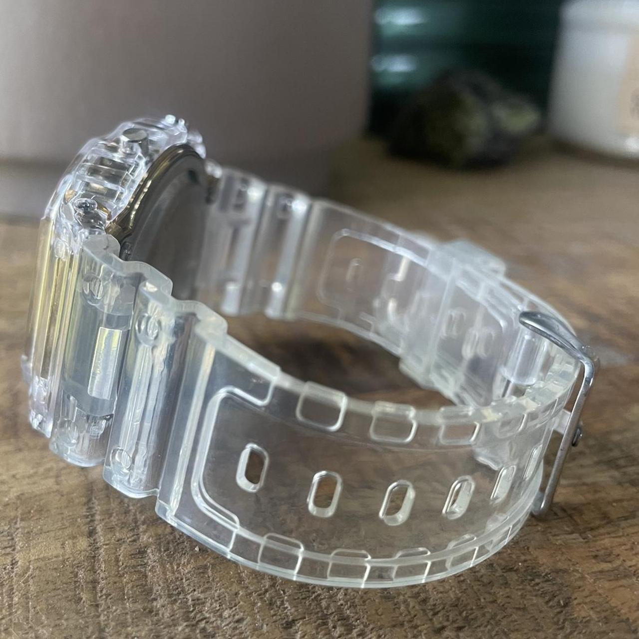 Chunky digital watch with gold face and clear... - Depop