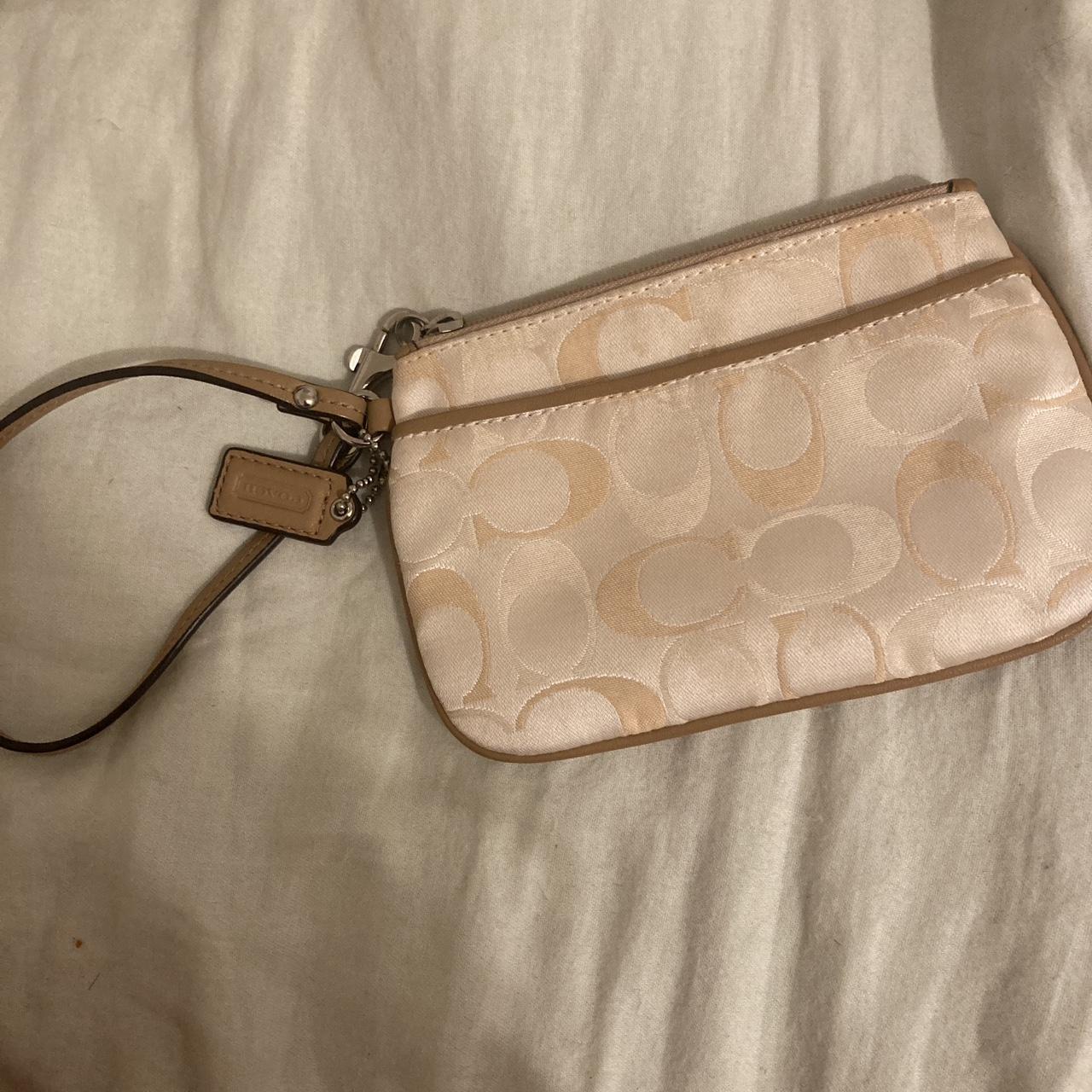 cream coach wristlet- slightly stained on back - Depop