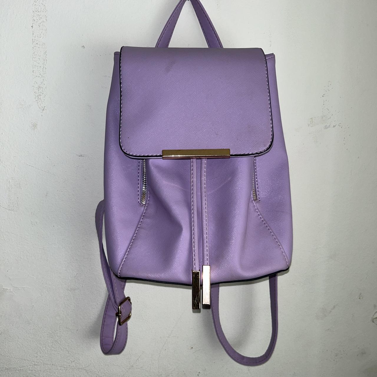 Lavender mini backpack with gold details... - Depop