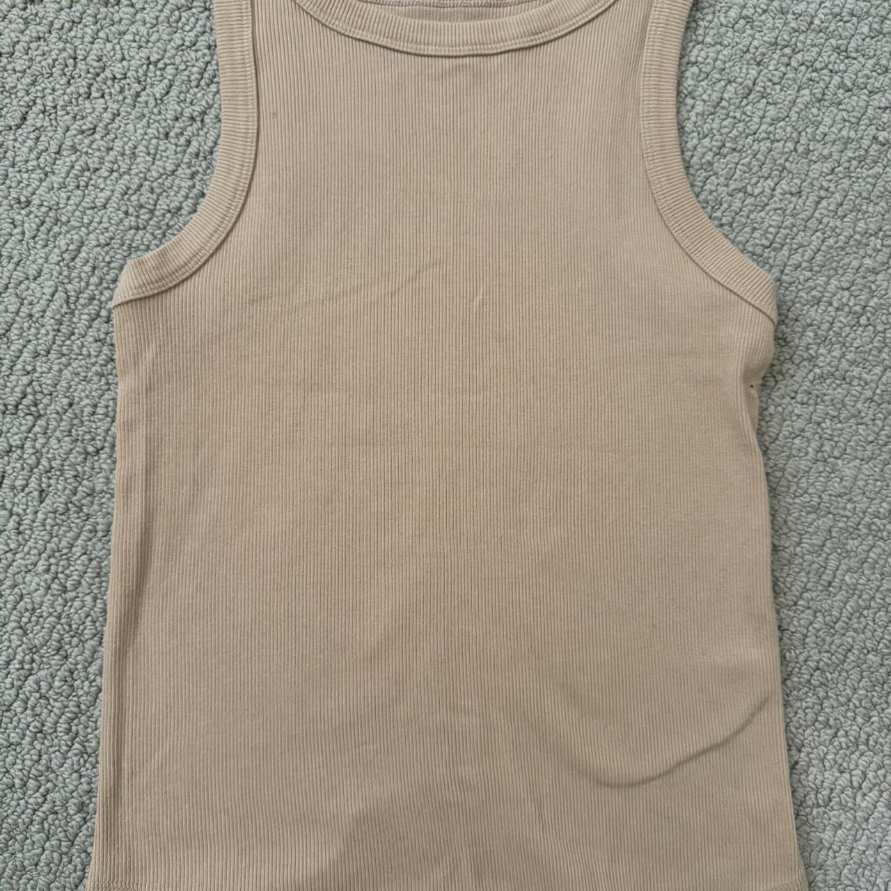 Basic tanned tank top, has great material and very... | Depop