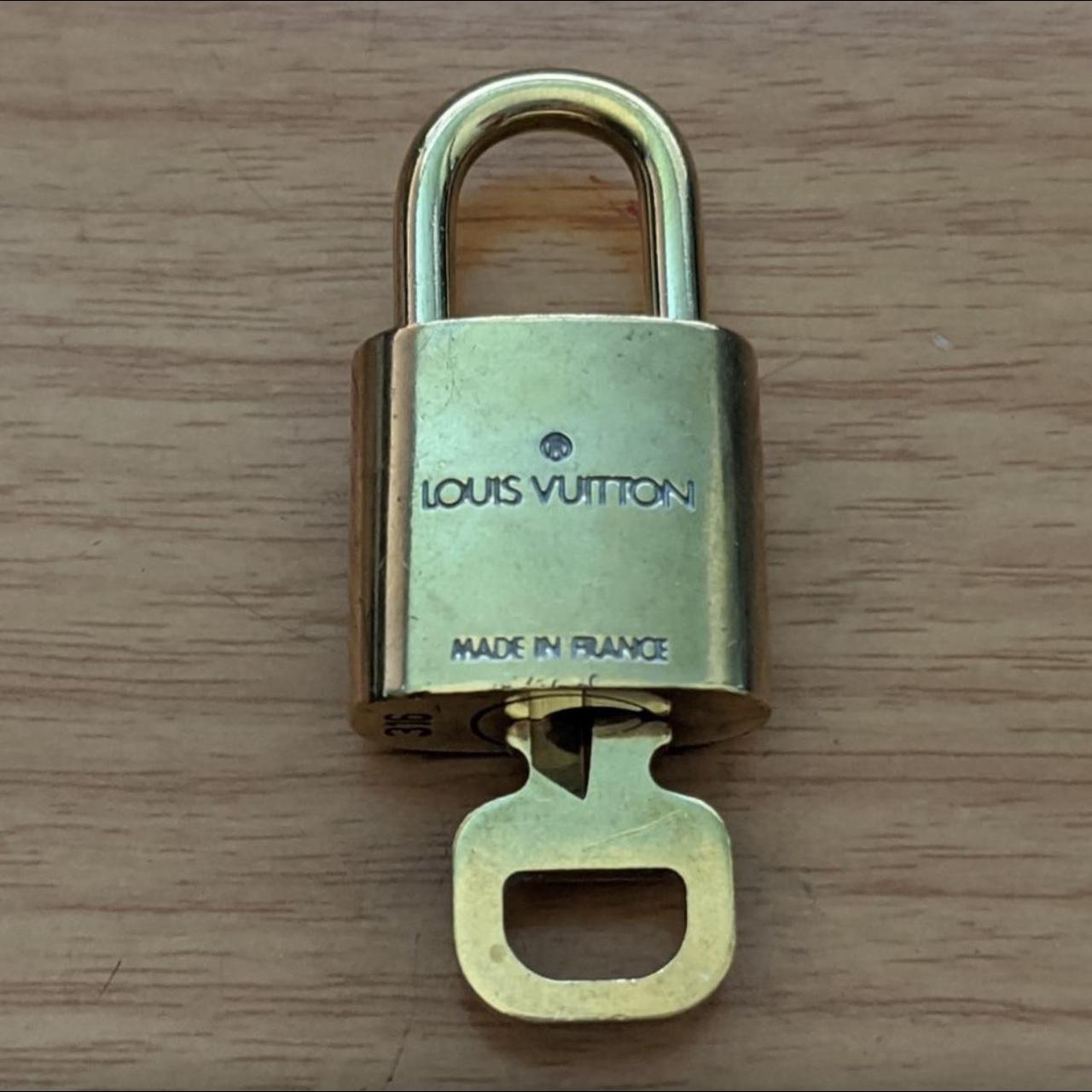 Authentic Louis Vuitton padded lock with key - Depop