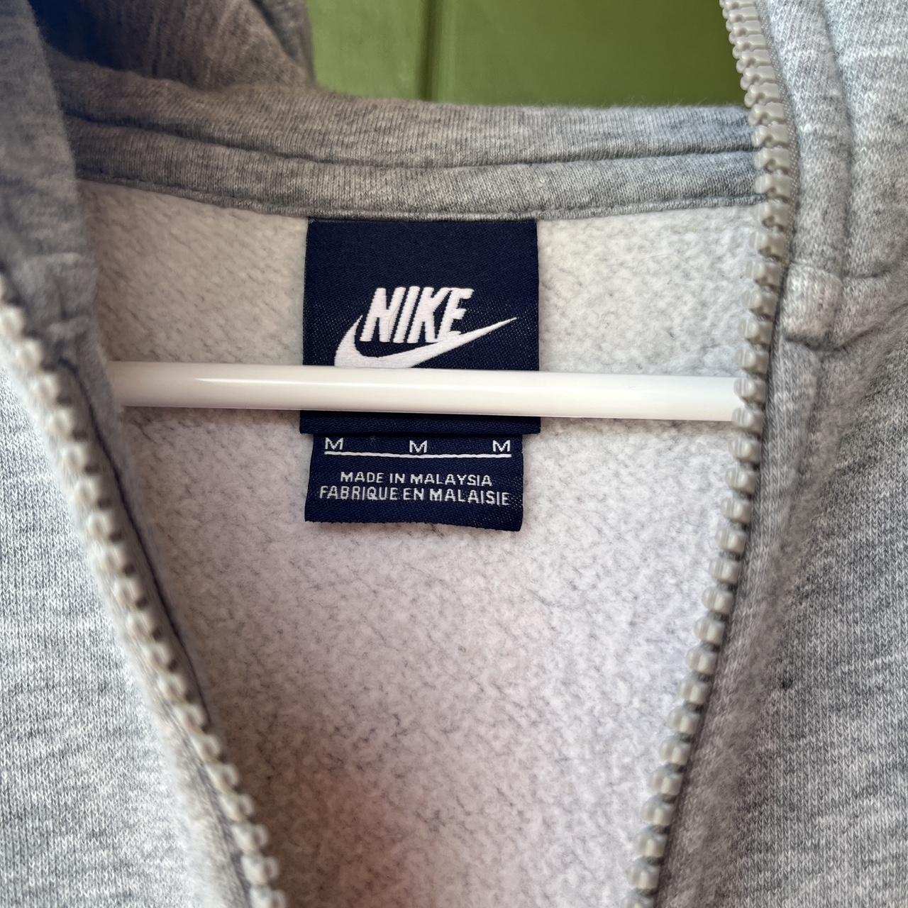Grey medium nike zip up jacket worn a few times, has... - Depop