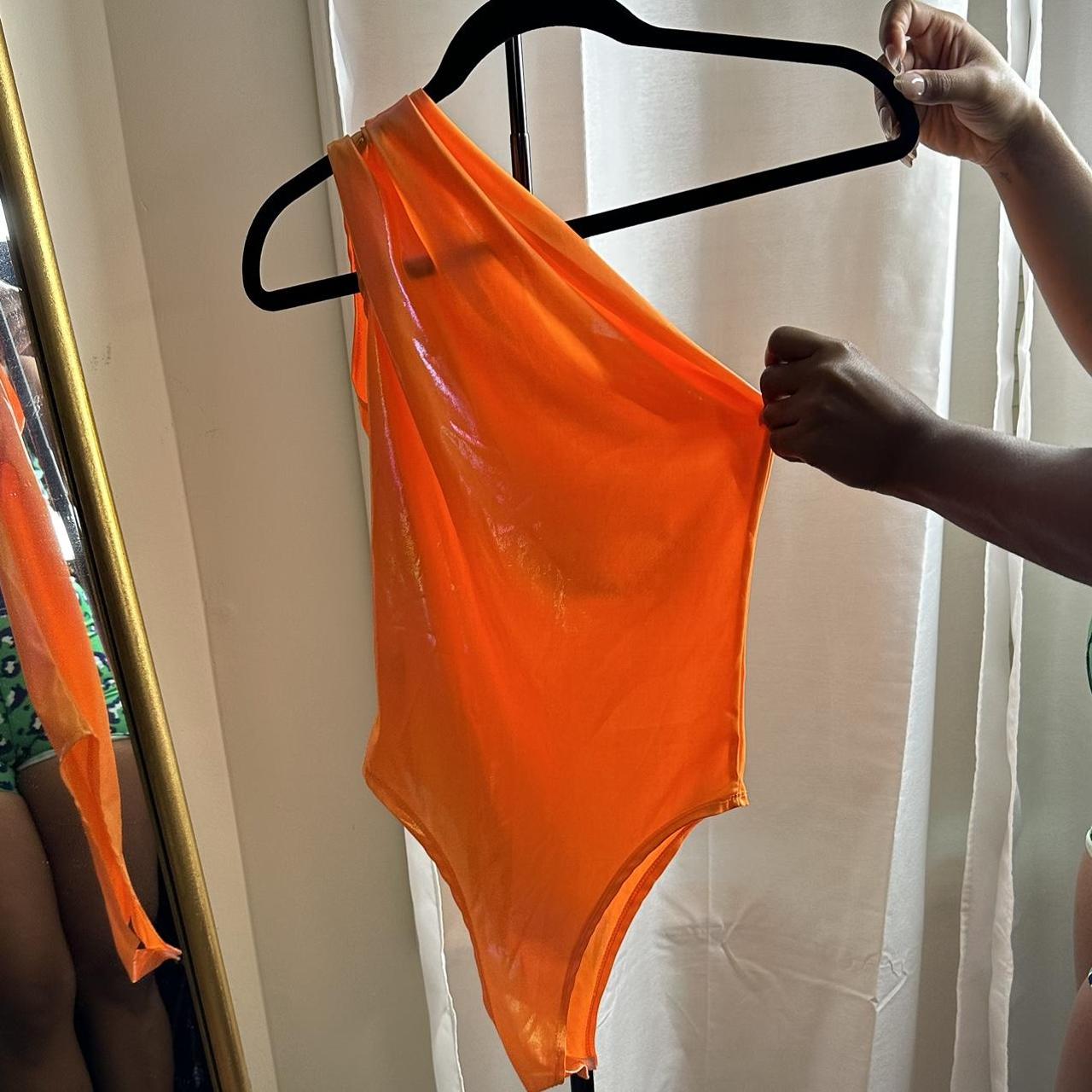 Small orange bodysuit, high gloss, great stretch. - Depop