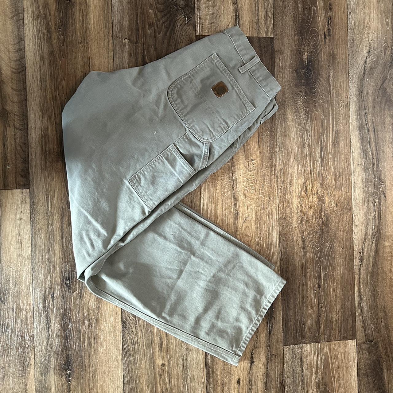 Tan dungaroo fit carhartt pants. Size: 34 Waist, 34... - Depop