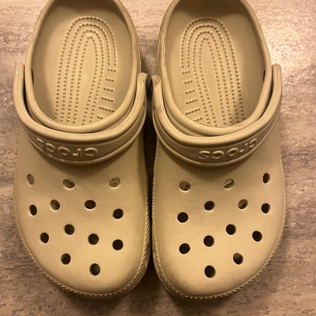 bone colored crocs sorta worn in the bottom as... - Depop