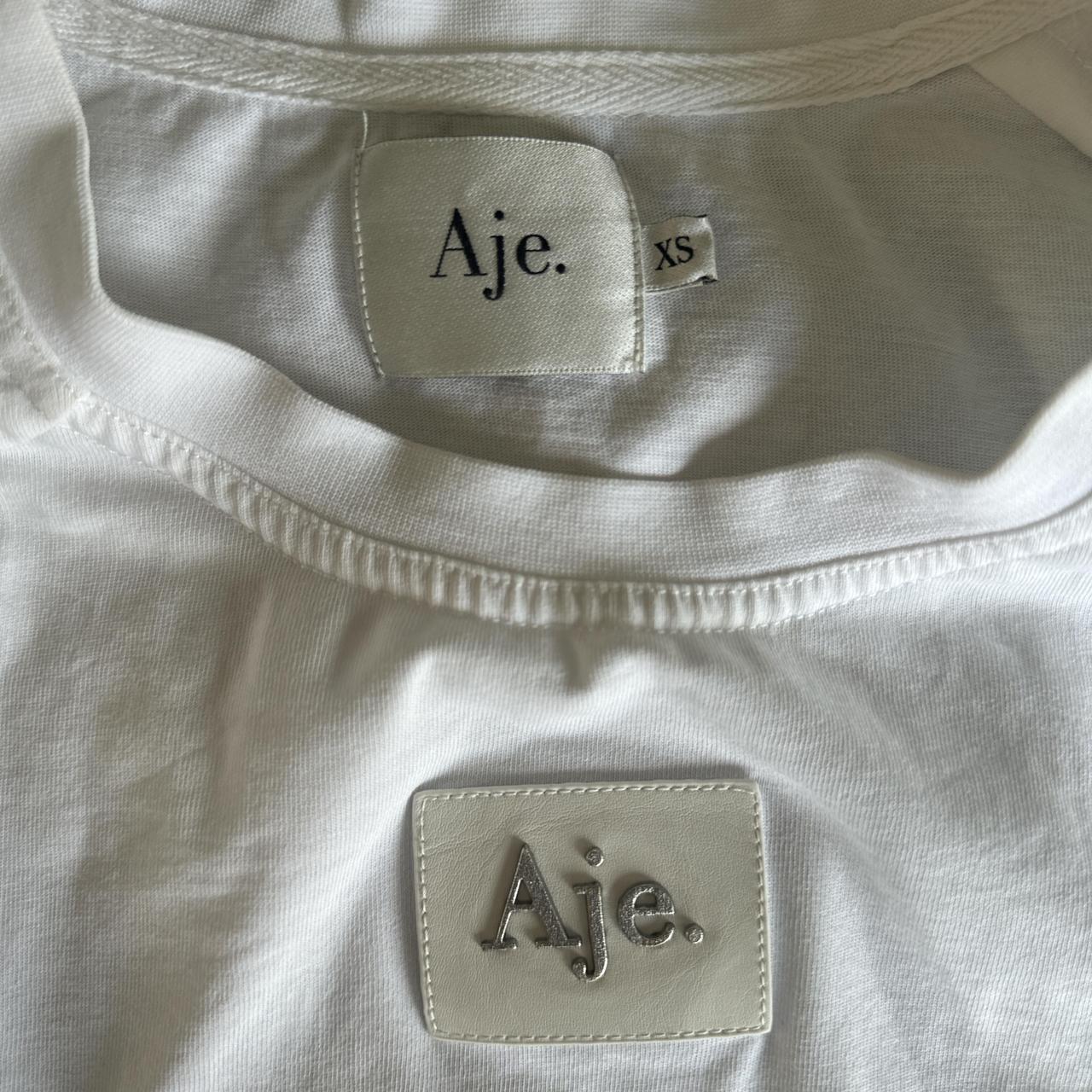 AJE singlet with logo. Size XS but would fit an 8.... - Depop