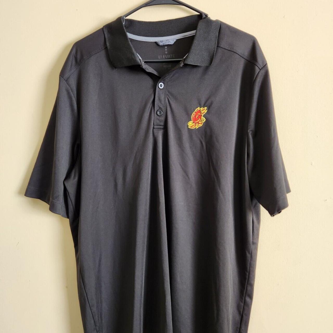 xl polo shirt with little character made of fire - Depop