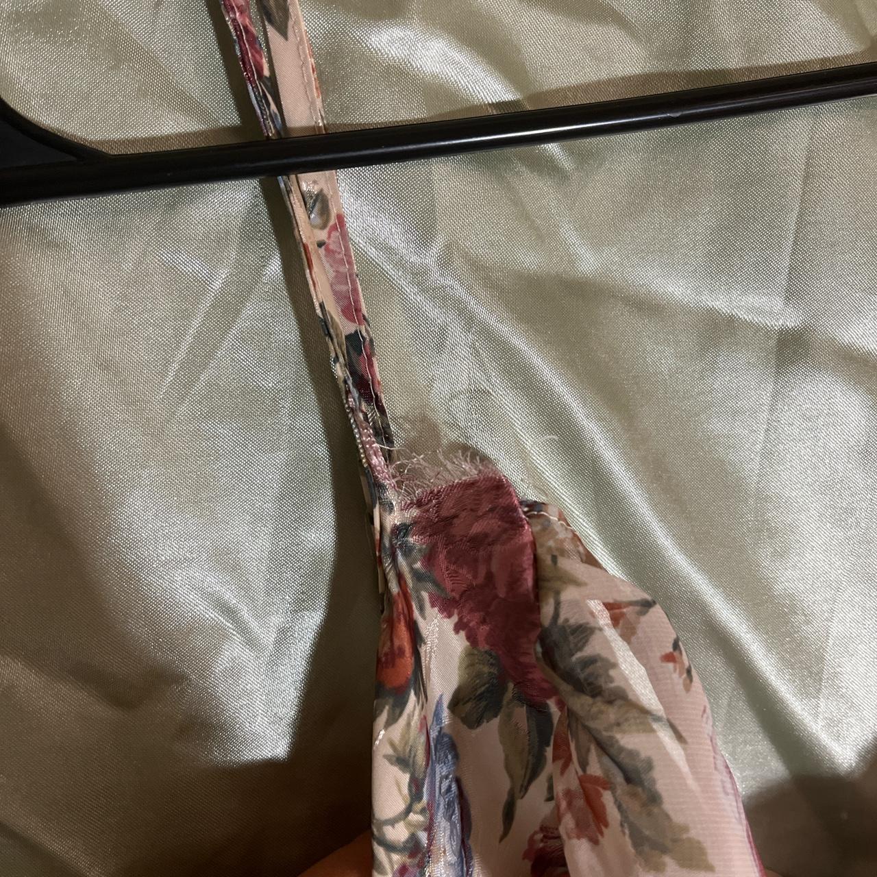 A vintage nightgown slip dress has the slightest rip. - Depop