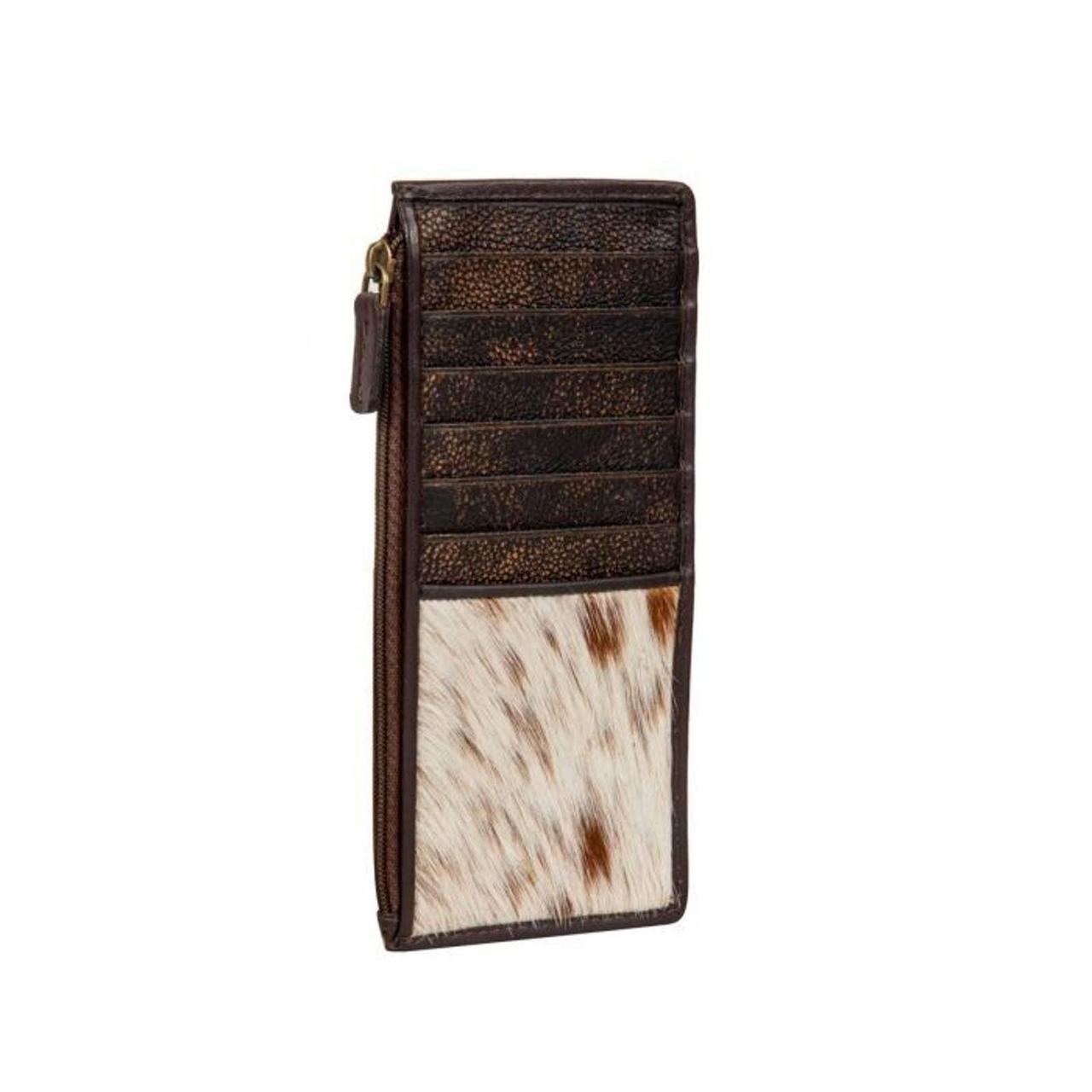 This stylish hair-on hide wallet features special... - Depop