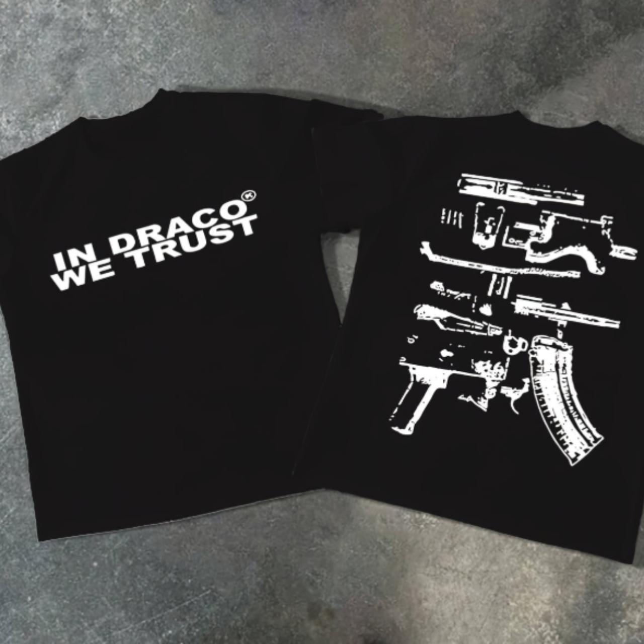 All-black tee with bold “In Draco We Trust” print –... | Depop