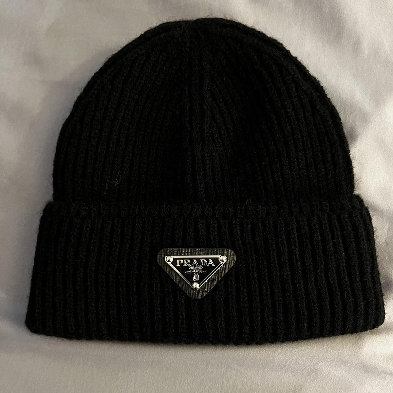 Black Prada beanie lightly worn, like... - Depop