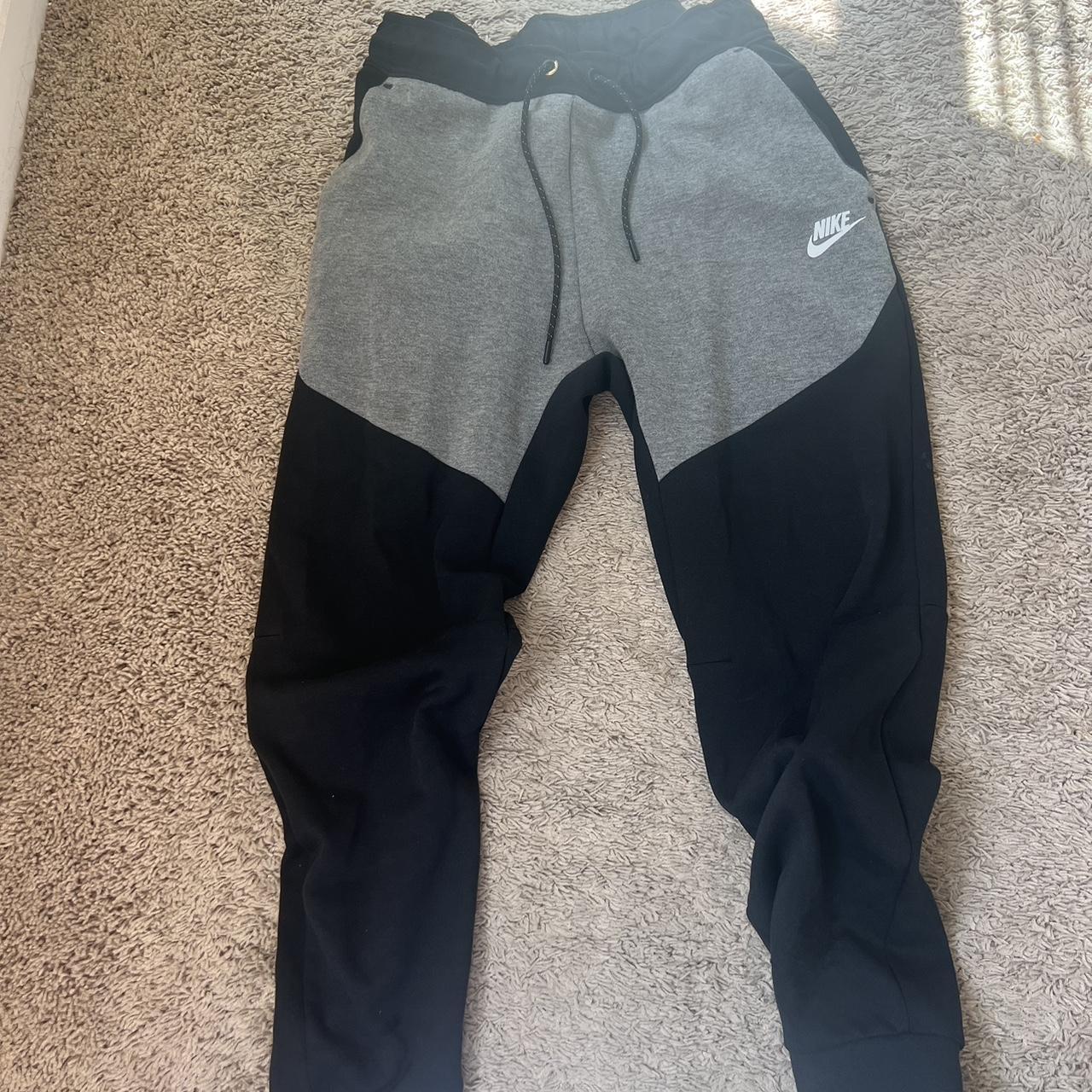 Dark grey and black Nike tech pants size M - Depop
