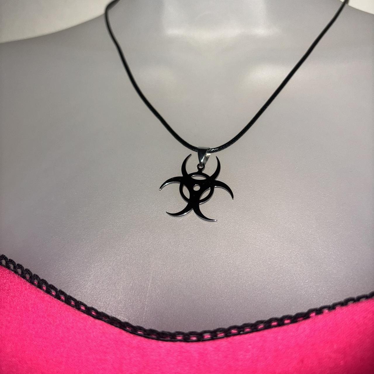 Biohazard necklace ☣️ Firm on price Super cute... - Depop