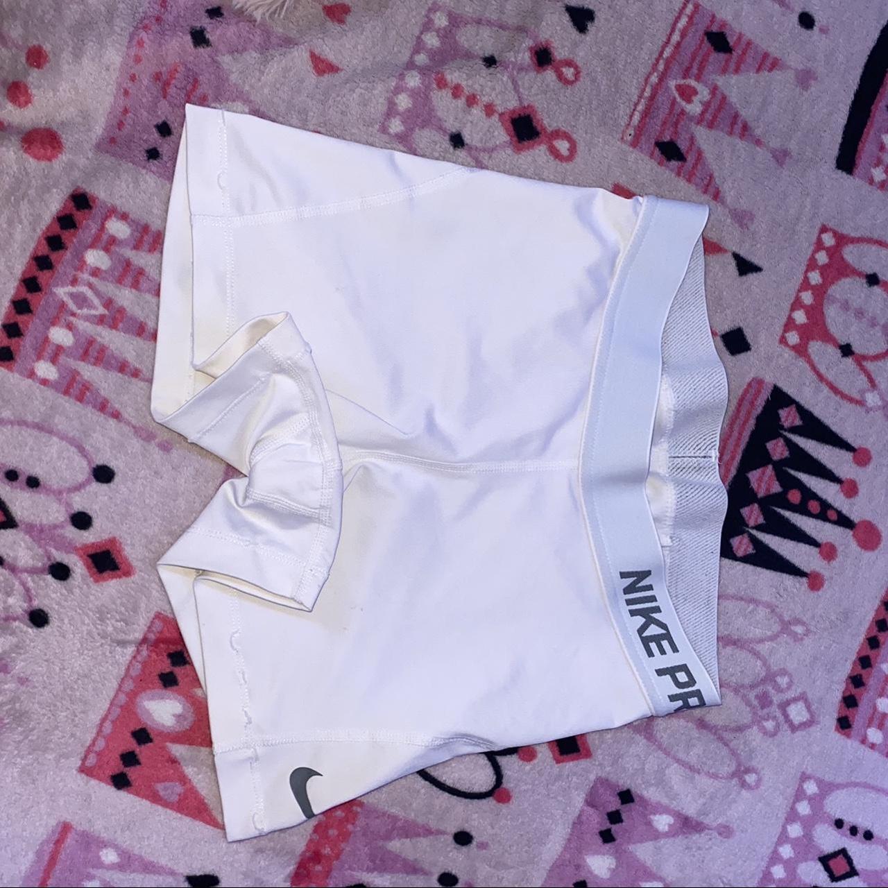 Nike Pro White shorts. Small spots and stitching... - Depop