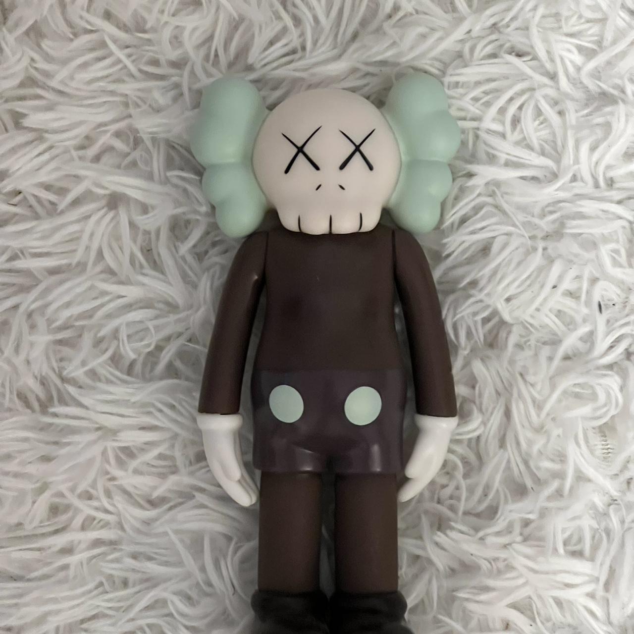 Brown and green KAWS figure price not firm #kaws | Depop