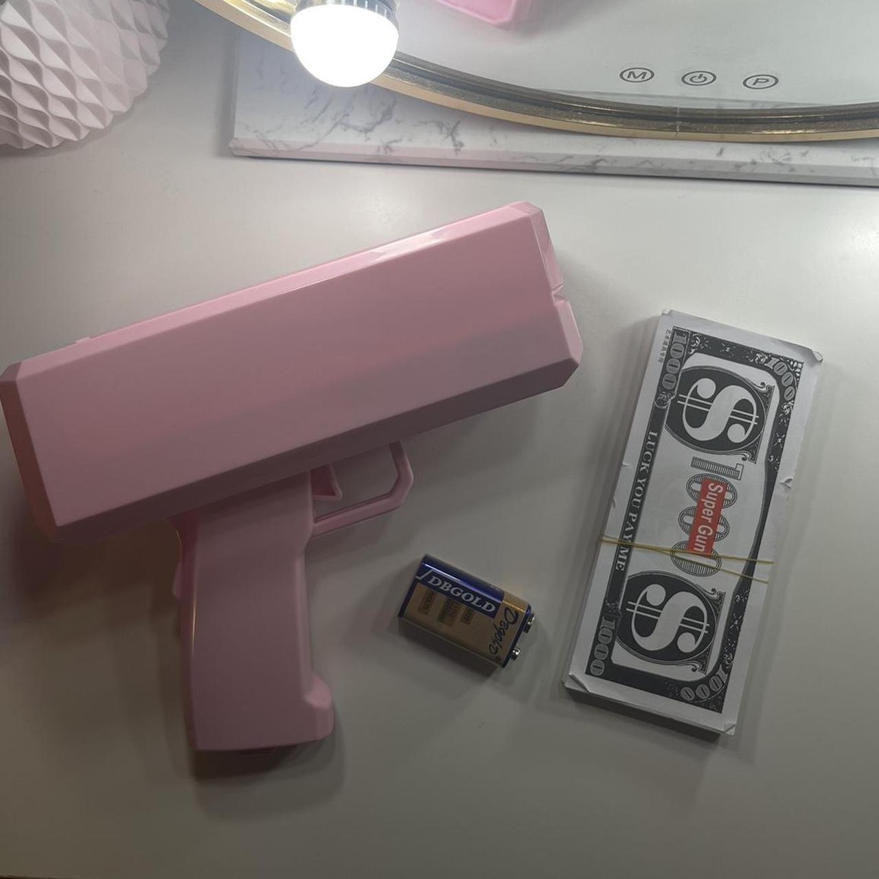 pink cash money gun. comes with battery and bills.... - Depop