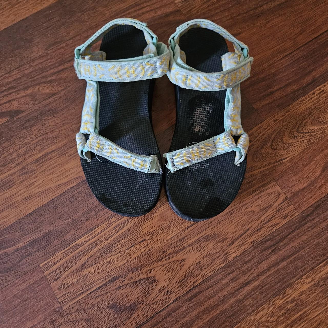 Blue and yellow Tevas. Some dirt in the footbed - Depop