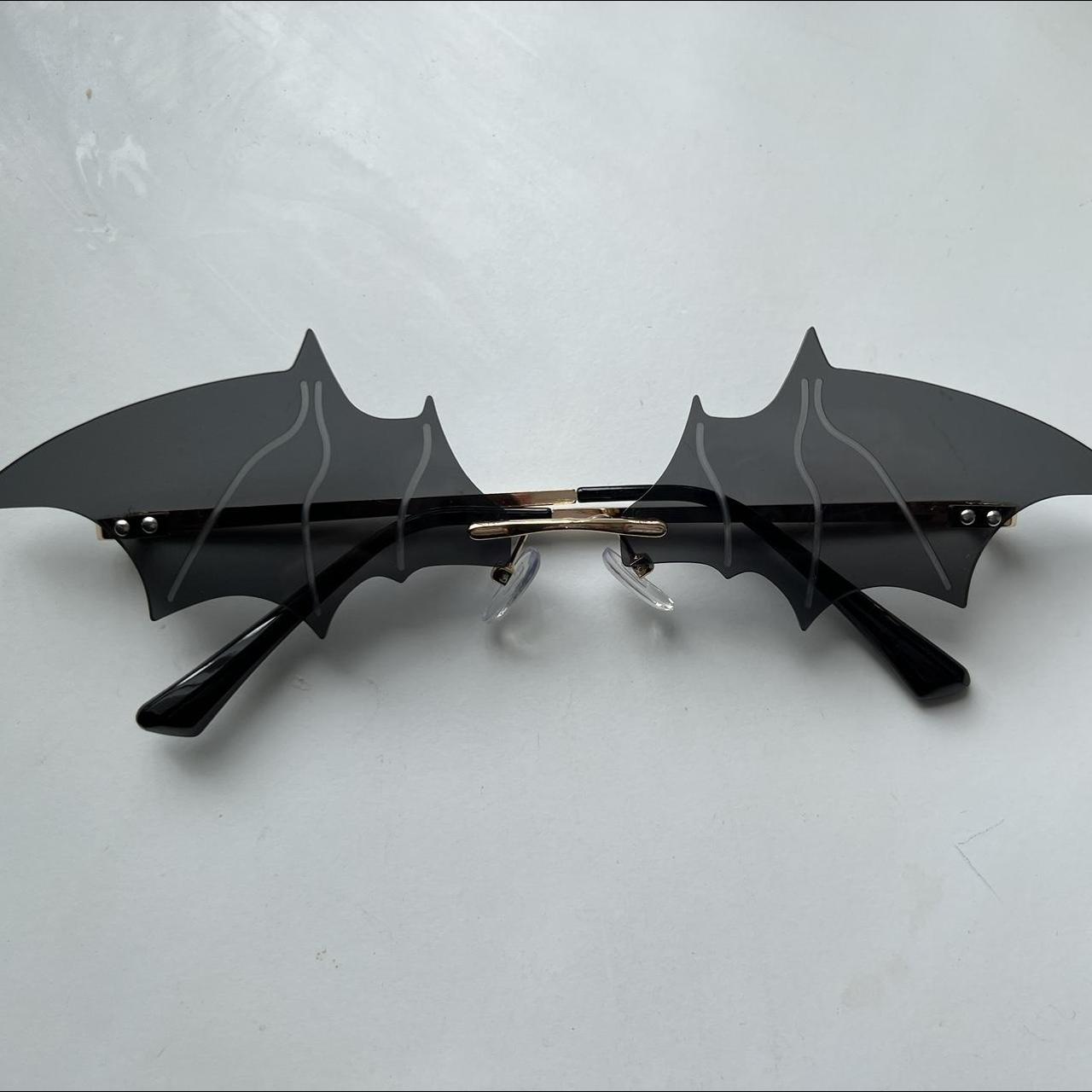 Gold and black bat wing inspired sunglasses - used... - Depop
