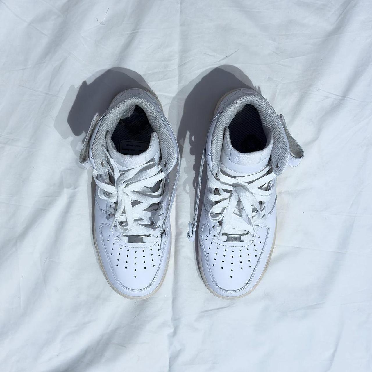 An all-time classic, the all-white AF1 Mid promises... - Depop