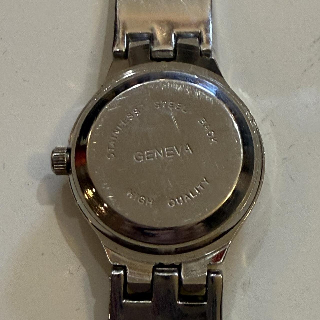 Gold and silver tone Geneva Quartz watch with black... | Depop