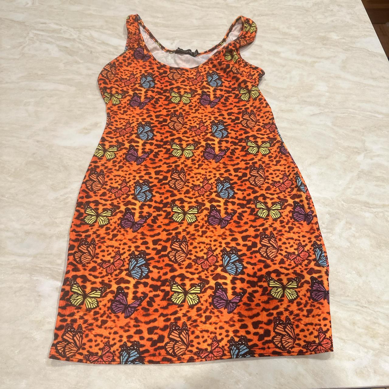 Neon Orange mini dress with butterfly print... | Depop